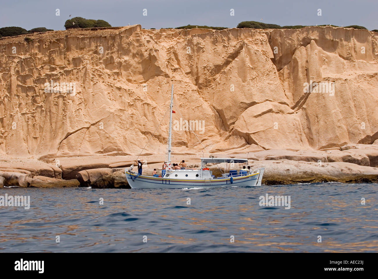 Traditional Turkish wooden boat tirhandil in Siren Rocks, Foca Izmir ...
