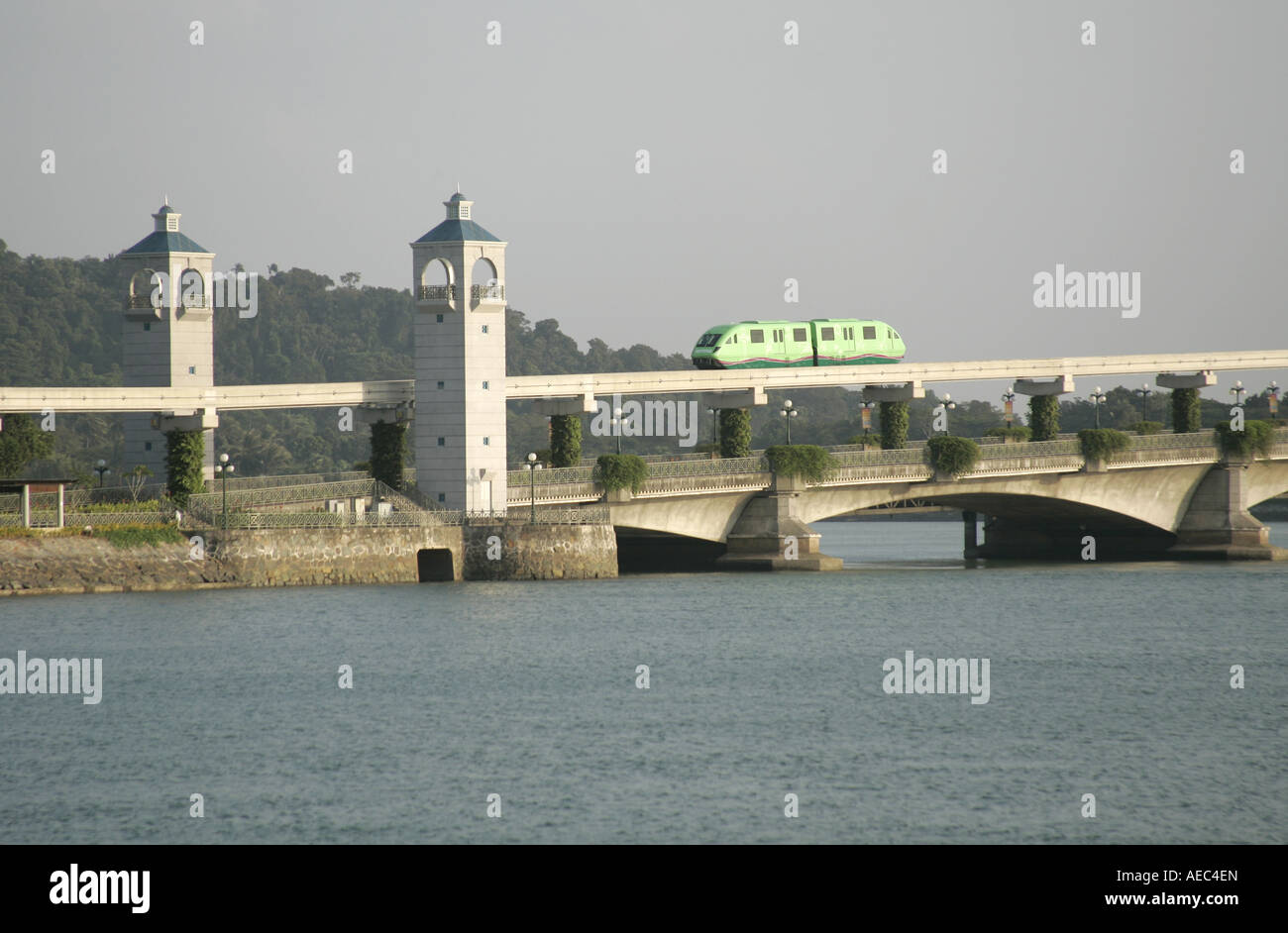 Sentosa Express Monorail trains travels across the Causeway Bridge to ...