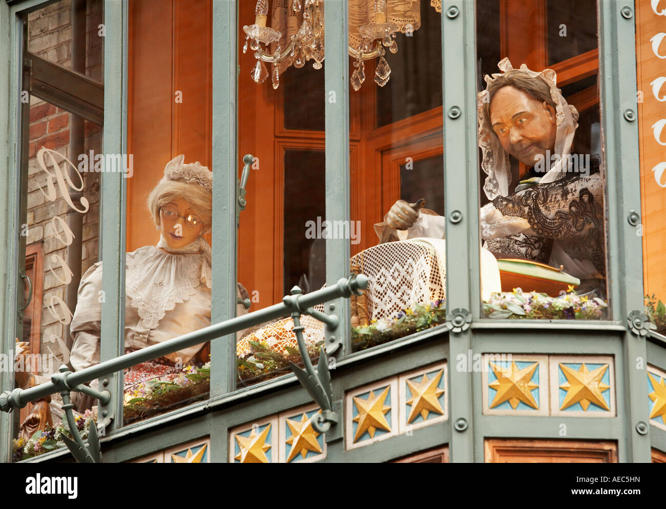 Balcony of lace shop with ladies working on their lace Wollestraat ...