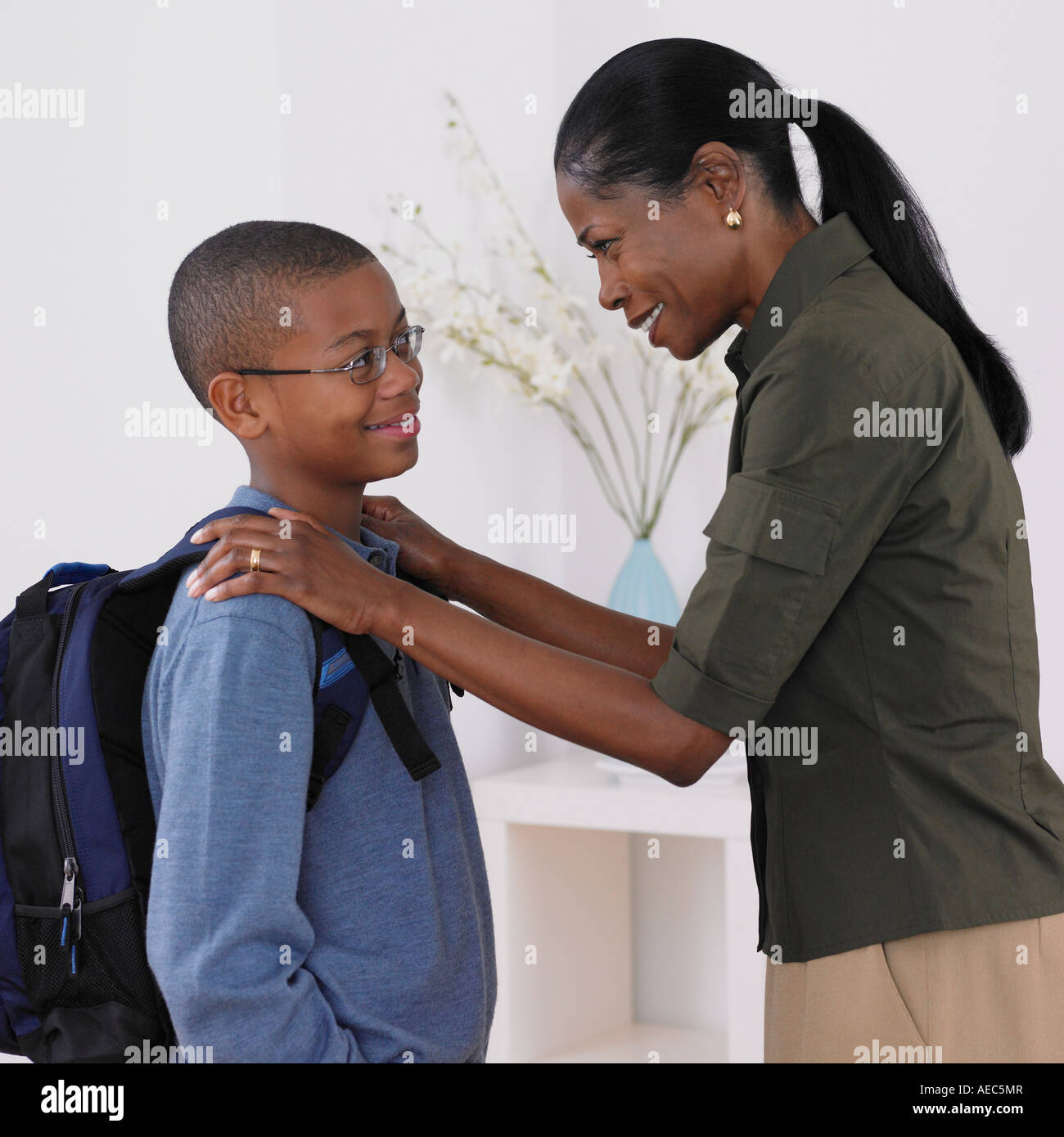 African mother seeing son off the school Stock Photo - Alamy