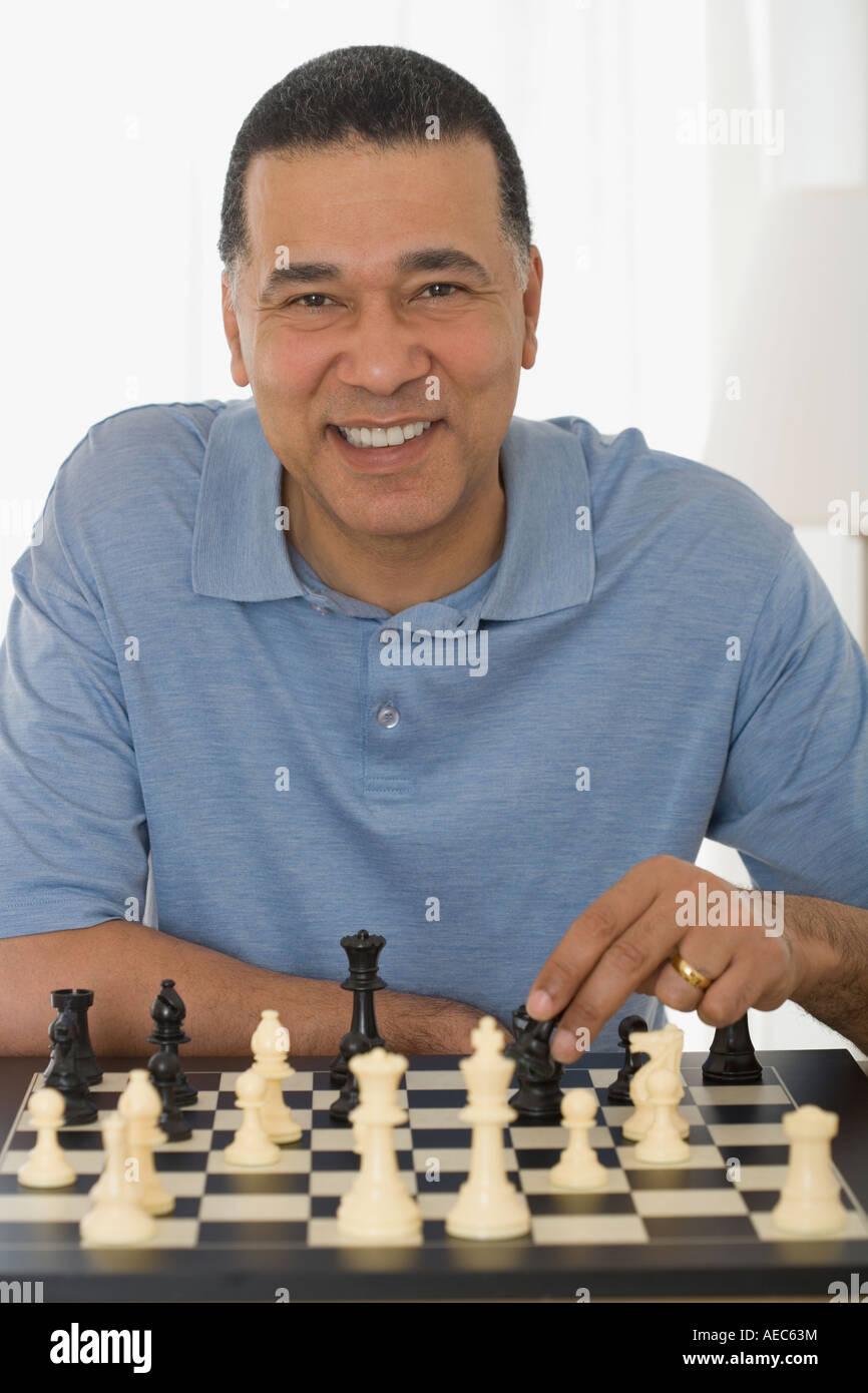 African man playing chess Stock Photo - Alamy