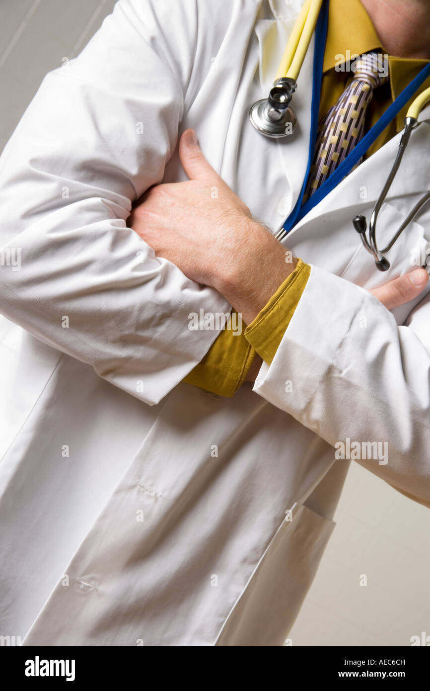 Medical doctor with his arms crossed Stock Photo - Alamy