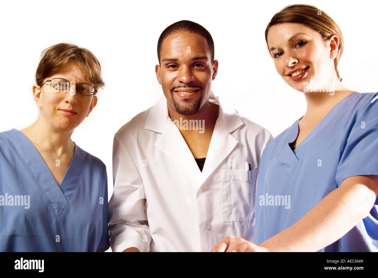 Three nurses wearing scrubs Stock Photo - Alamy