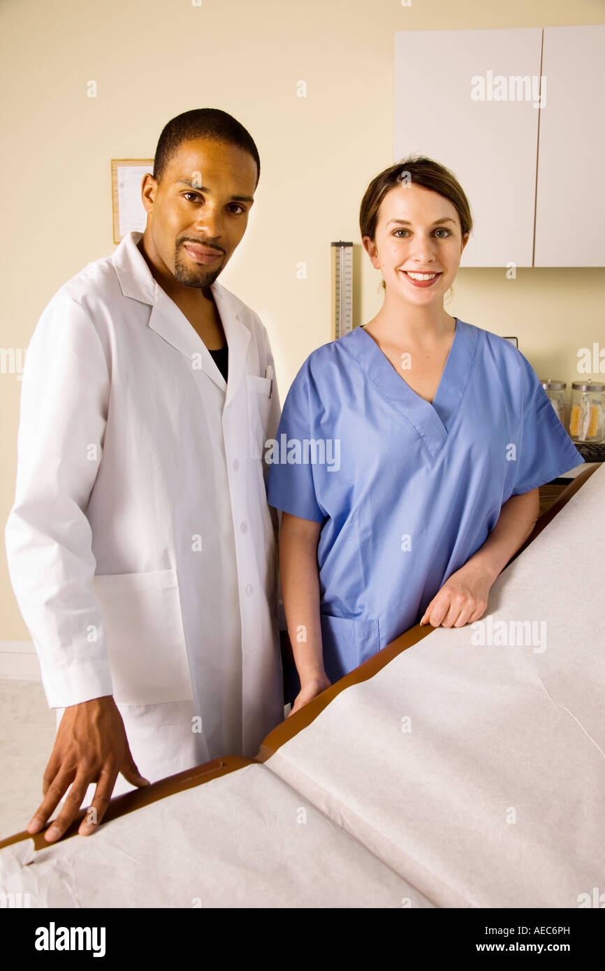 Two healthcare professionals discuss hi-res stock photography and ...