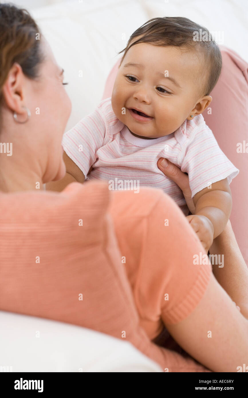 Hispanic baby smiling at mother Stock Photo - Alamy