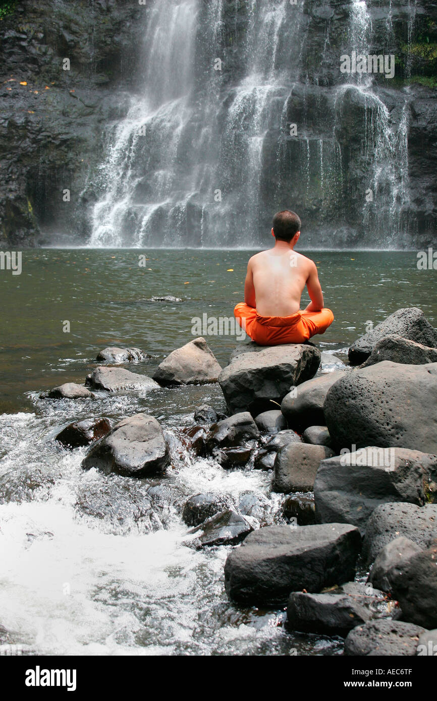 Buddhist monk at the Tat Yeung waterfall on the Bolaven Plateau, Laos ...