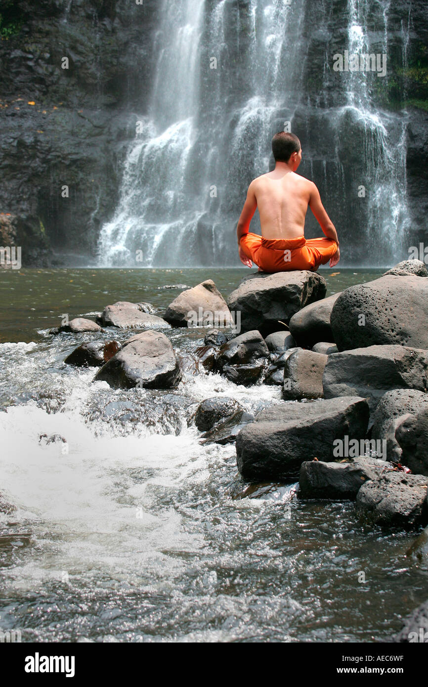 Buddhist monk at the Tat Yeung waterfall on the Bolaven Plateau, Laos ...