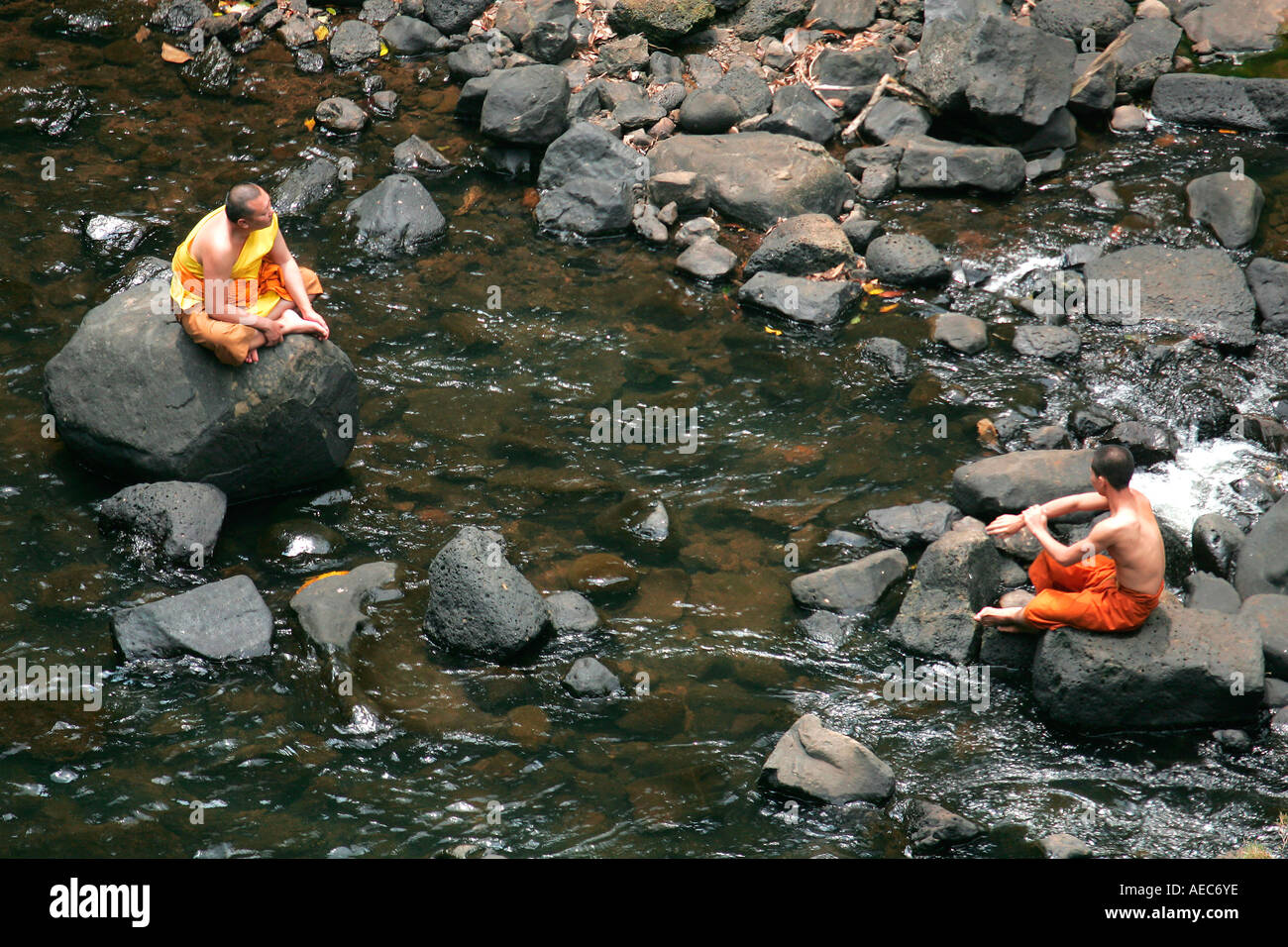 Buddhist monks at the Tat Yeung waterfall on the Bolaven Plateau, Laos ...