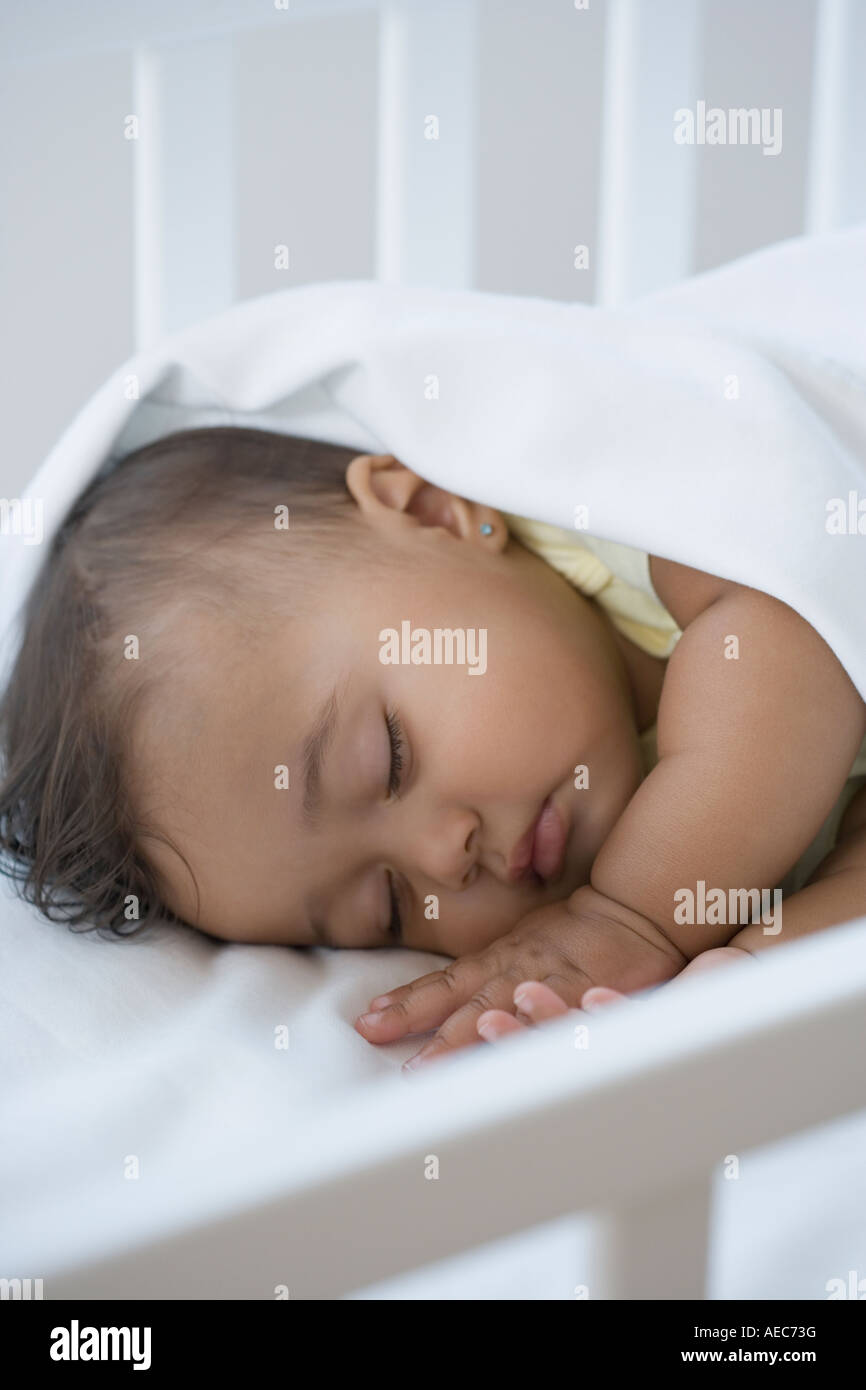 Close up of Hispanic baby sleeping Stock Photo - Alamy