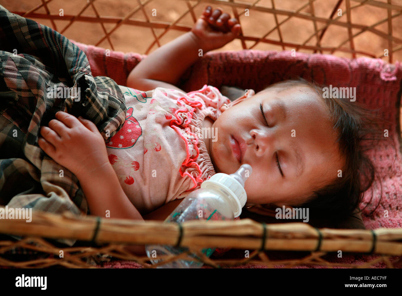 Native child asleep in a cradle at a minority village on the Bolaven ...
