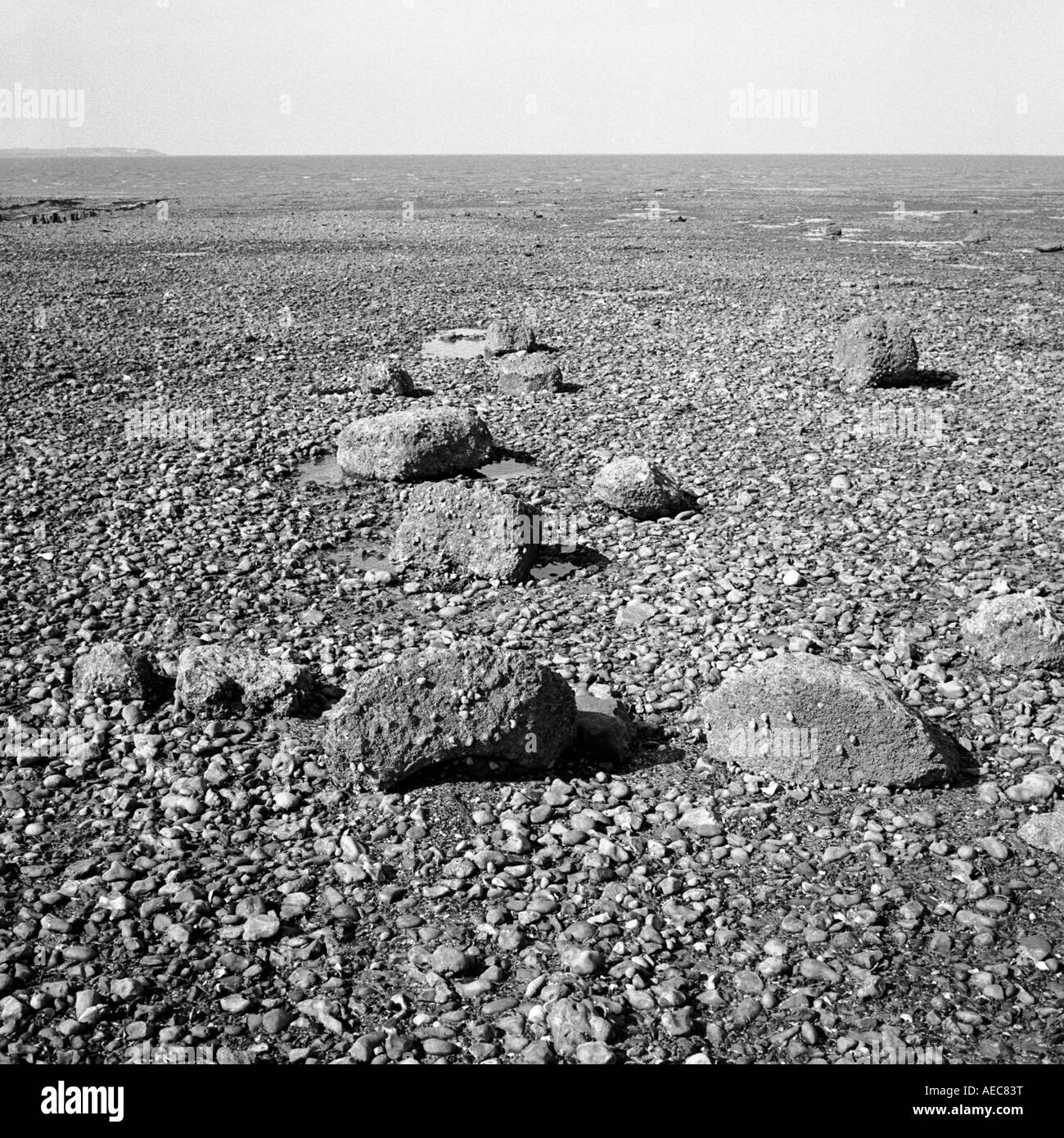 Landscape image of a desolate pebble beach Stock Photo - Alamy