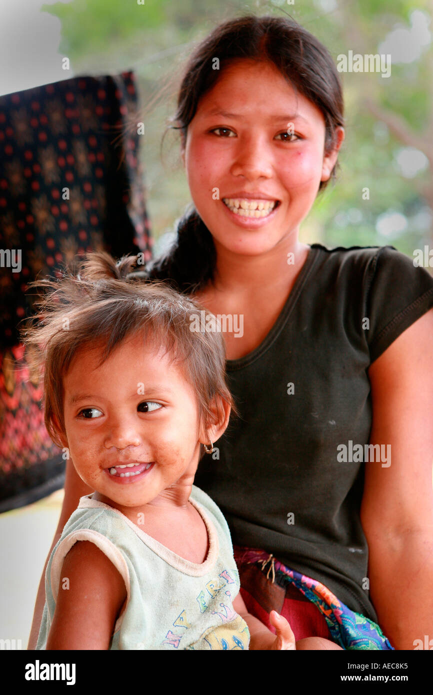 Native mother and daughter in a minority village on the Bolaven Plateau ...