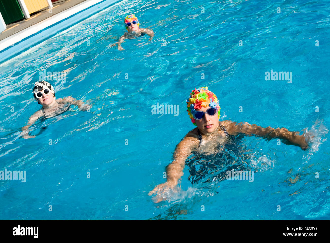 Women wearing vintage costumes swim at Tooting Bec Lido Tooting London ...