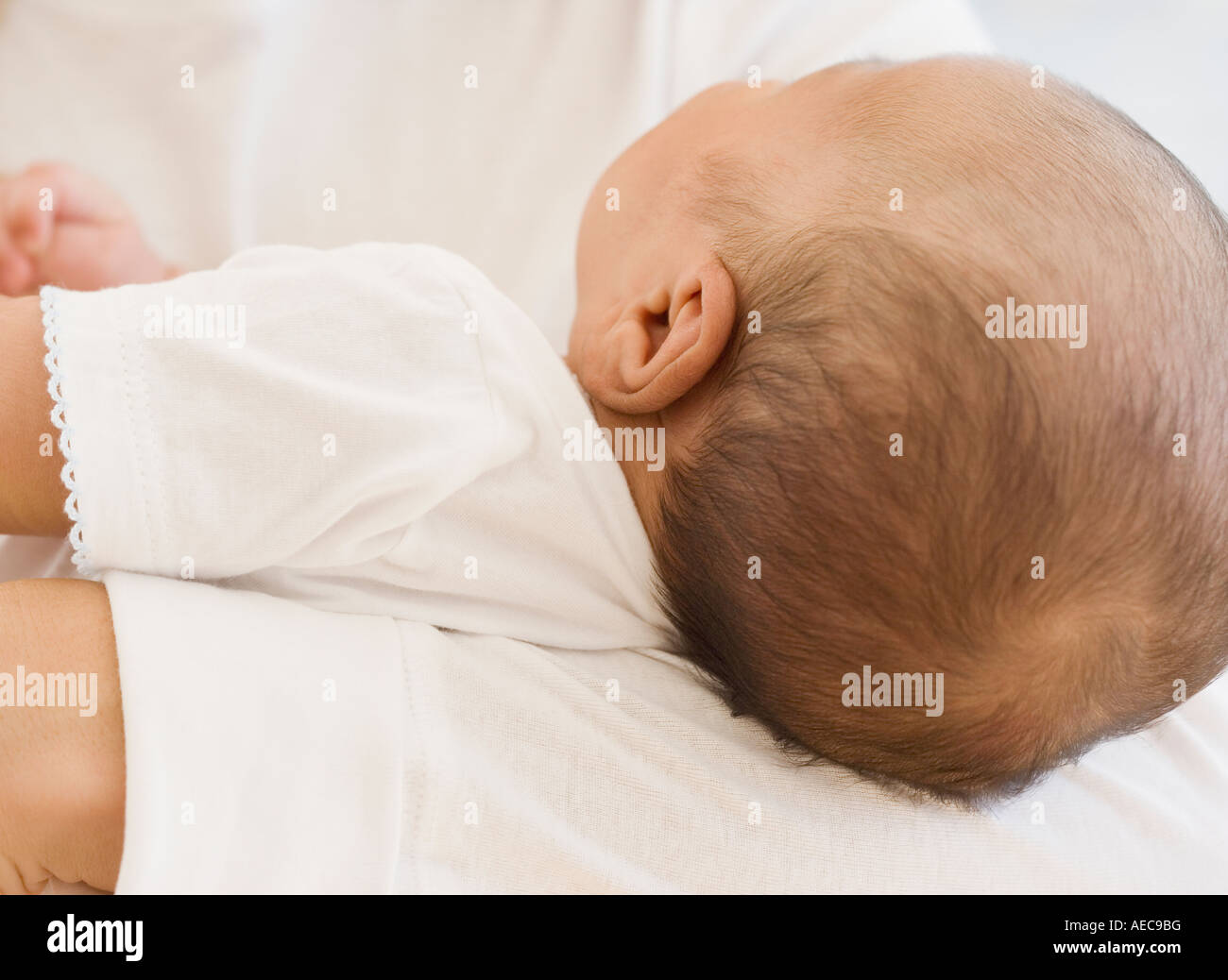 Young mother holding her newborn baby in her arms hi-res stock ...