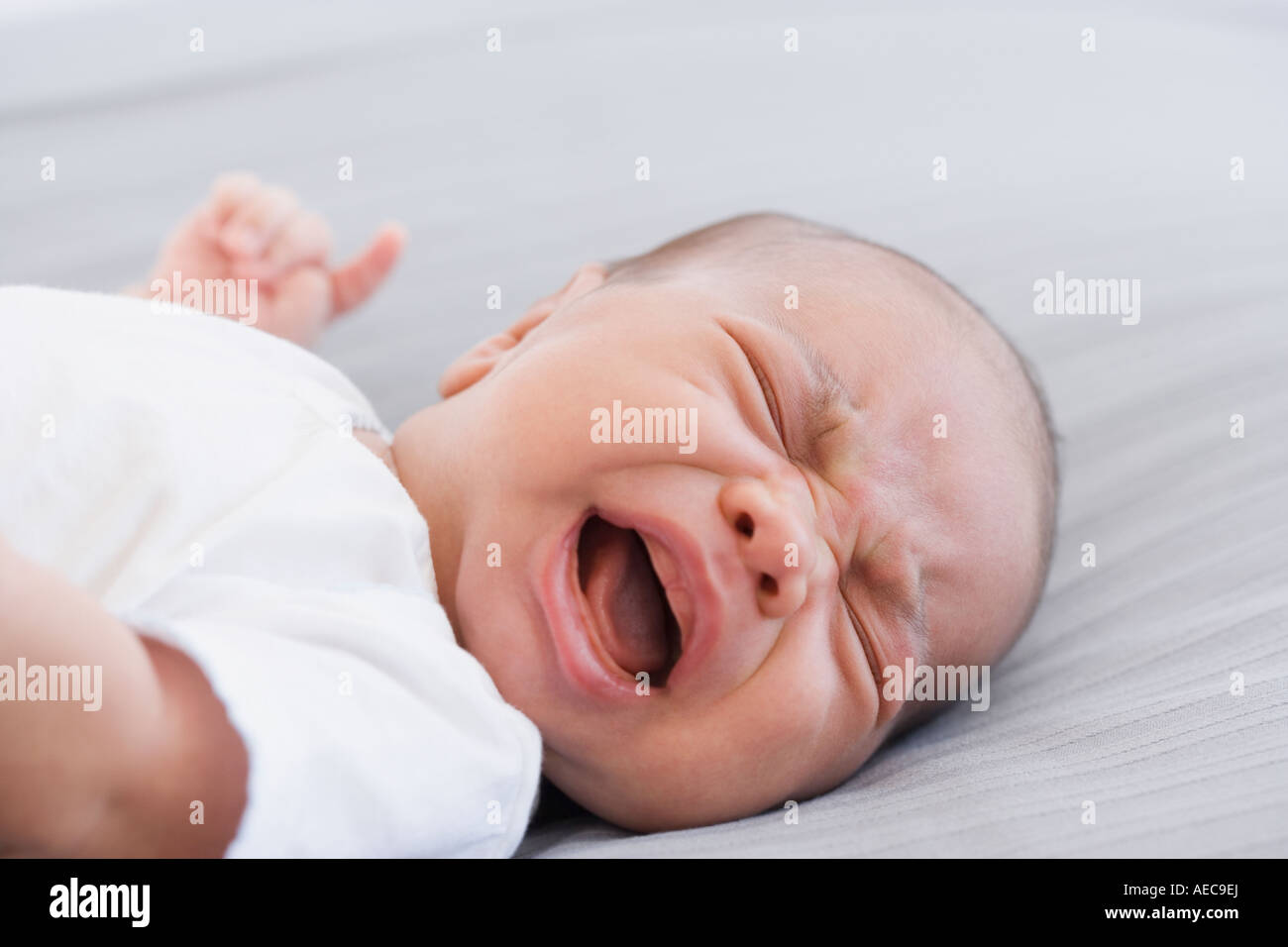 Close up of crying newborn baby Stock Photo - Alamy