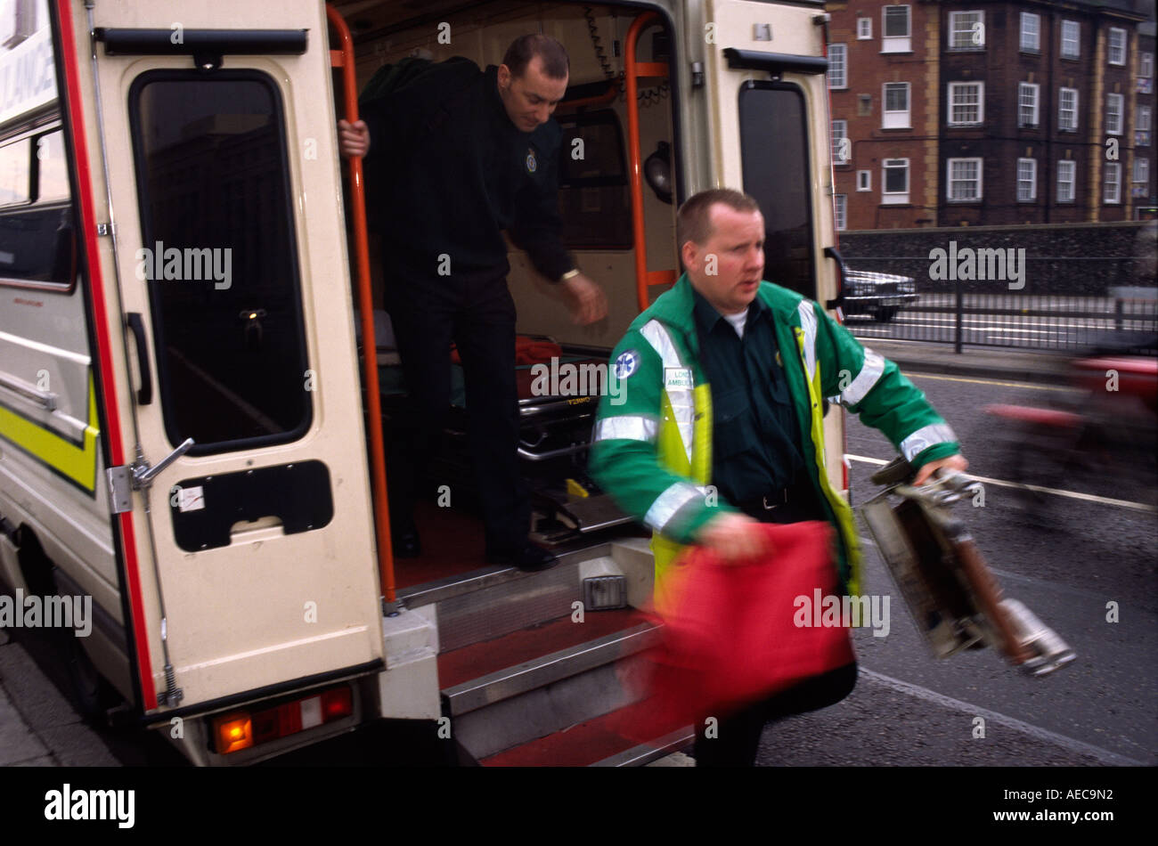 London ambulance crew jump out the back of an ambulance to respond to a ...