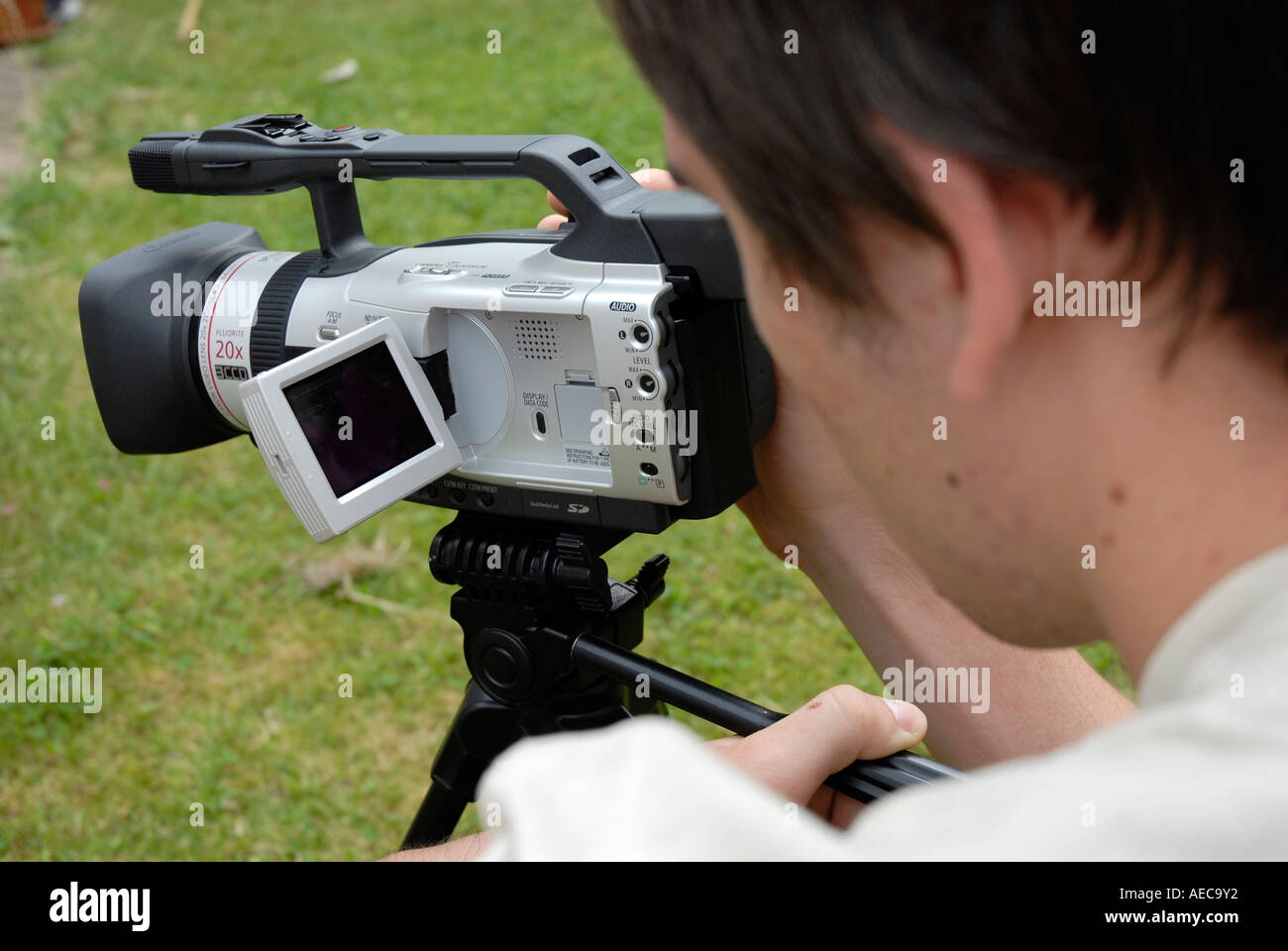 Teenager using video camera Stock Photo - Alamy