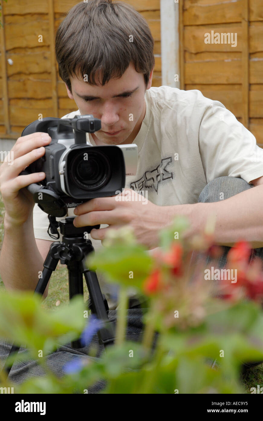 Teenager using video camera Stock Photo - Alamy