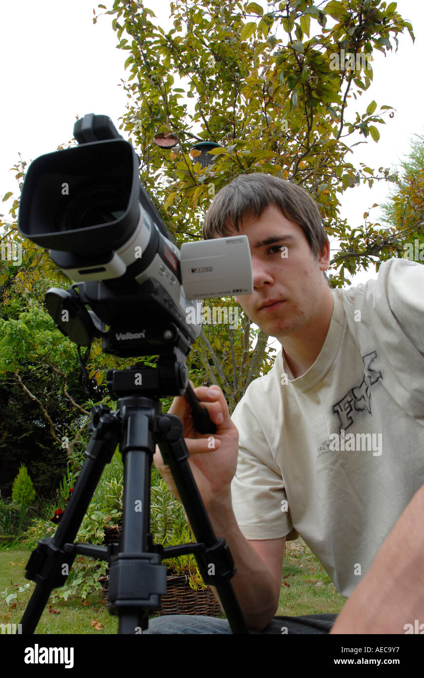 Teenager using video camera Stock Photo - Alamy