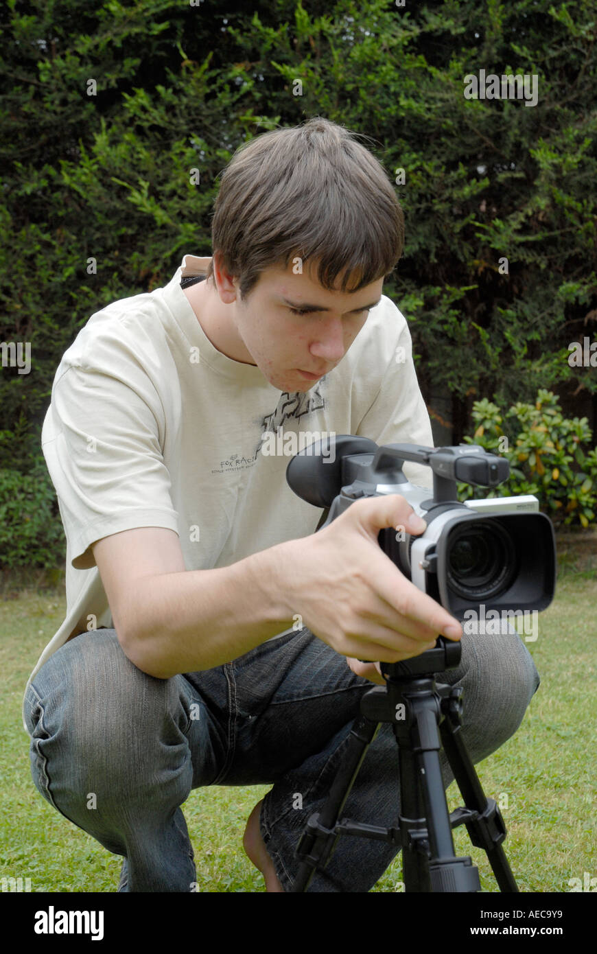 Teenager using video camera Stock Photo - Alamy