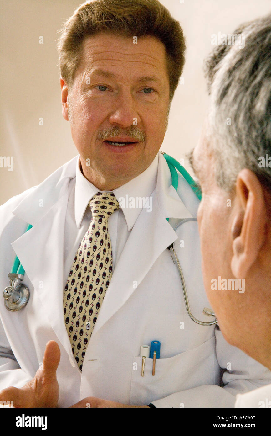 Physician explains treatment to patient Stock Photo - Alamy