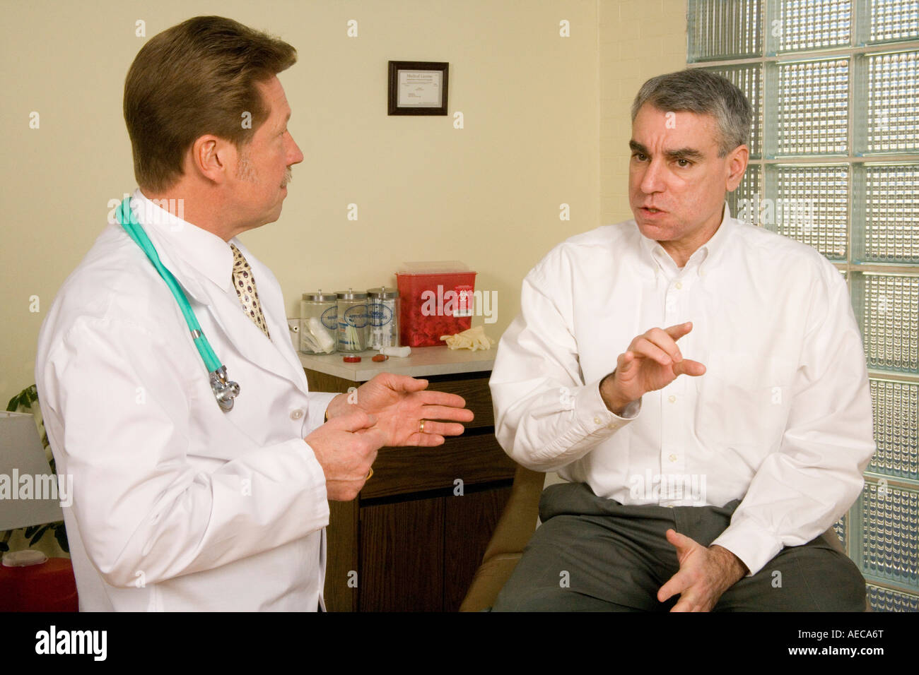 Doctor and patient discuss treatment Stock Photo - Alamy
