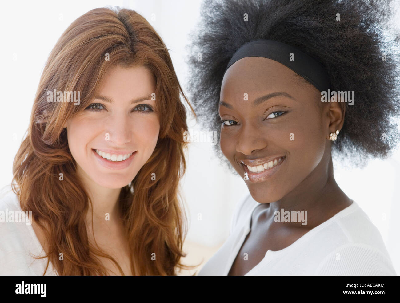 Two women smiling Stock Photo - Alamy