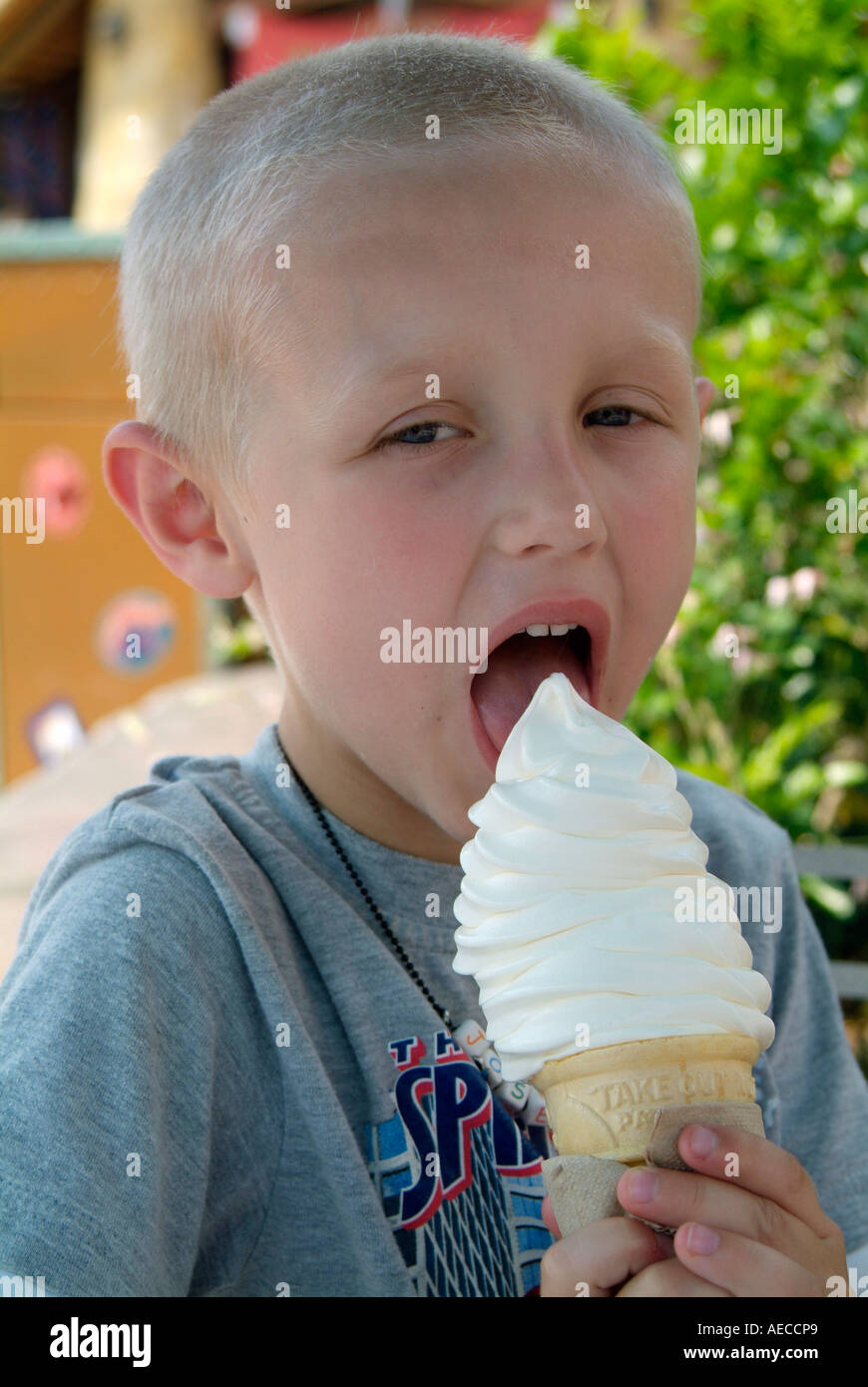 Boy eating ice cream cone child close up cone consuming hi-res stock ...