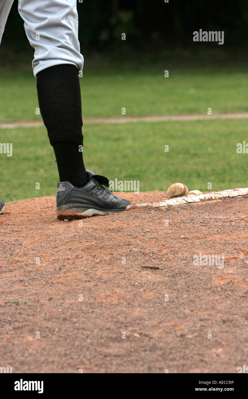Baseball player standing on mount Stock Photo - Alamy