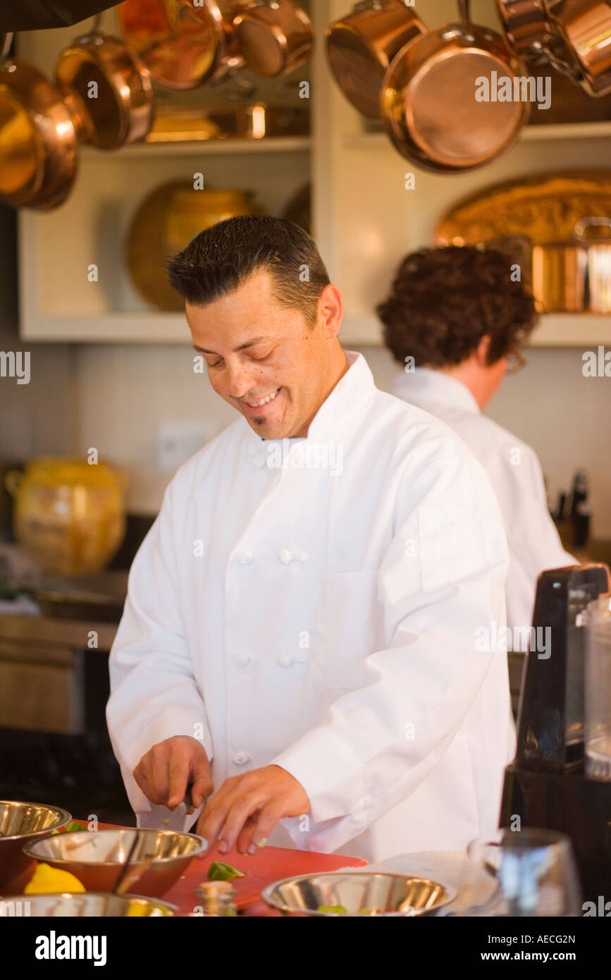 chef from Restaurant prepares a Spanish dish of paella at a cooking ...