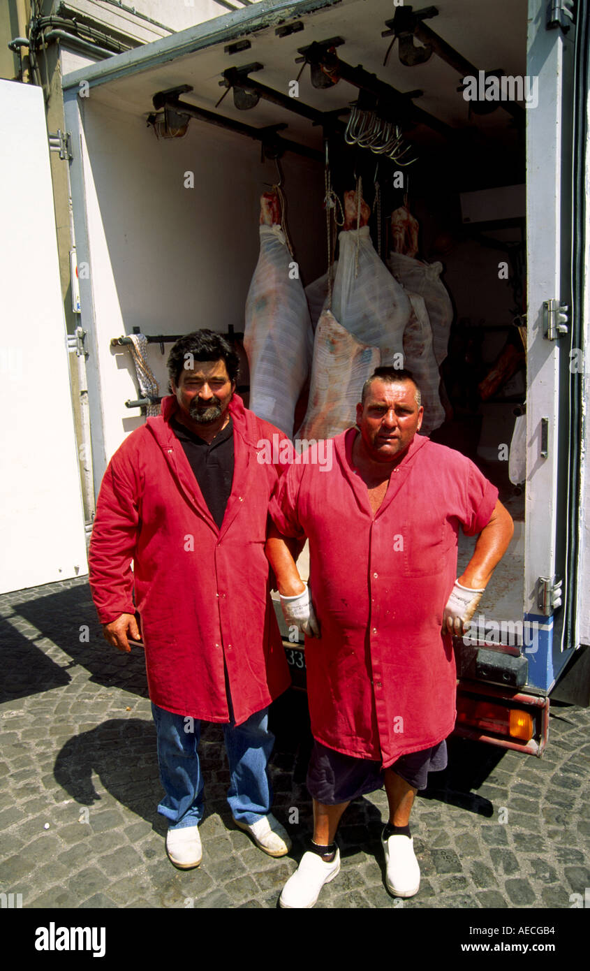 Two italian butchers pose in front of their van in the eastern port of ...