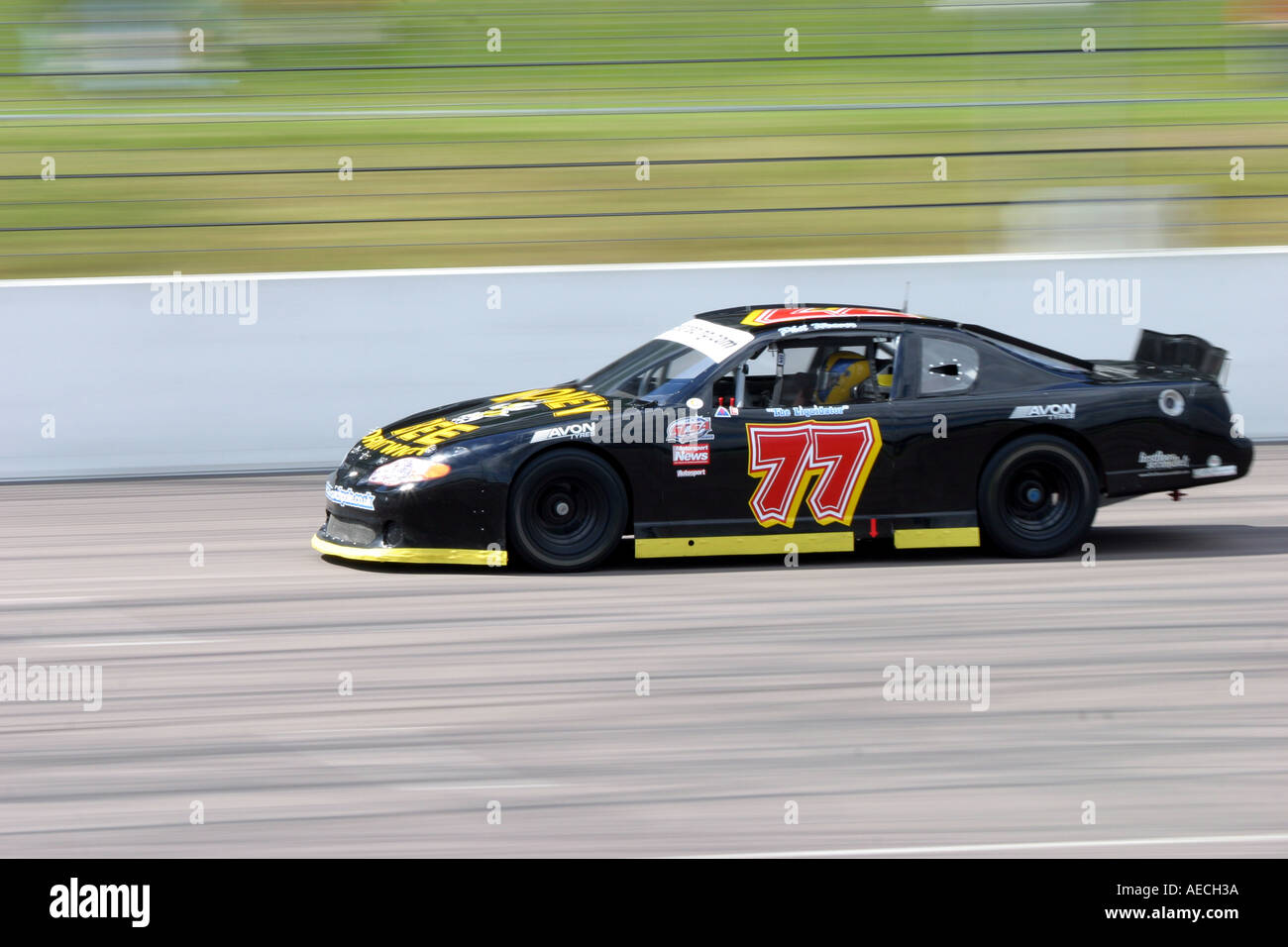 V8 Nascar type stock cars racing on a banked oval circuit Stock Photo ...