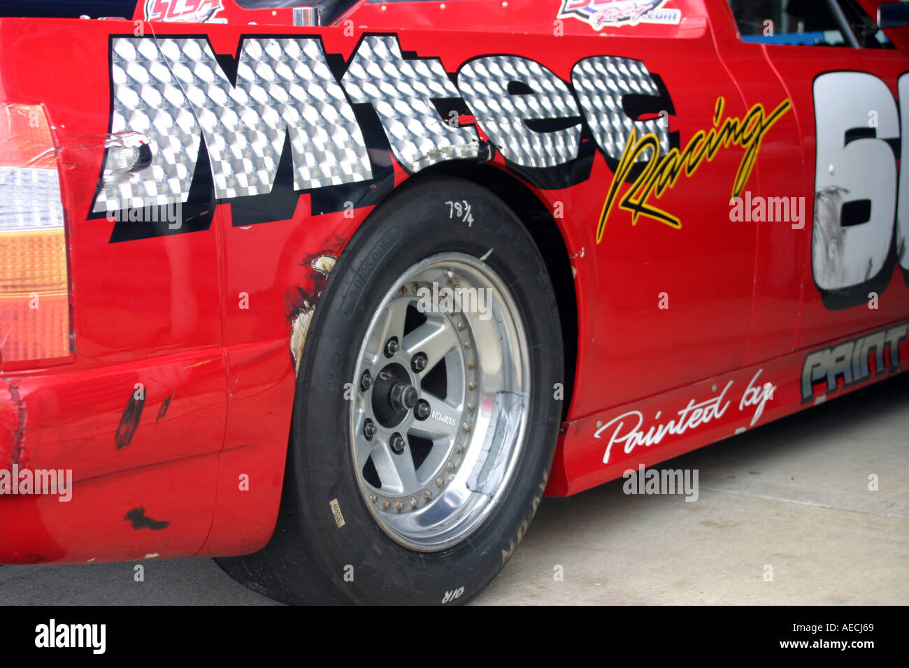 Close up of the rear of a red racing pick up truck showing the rear ...
