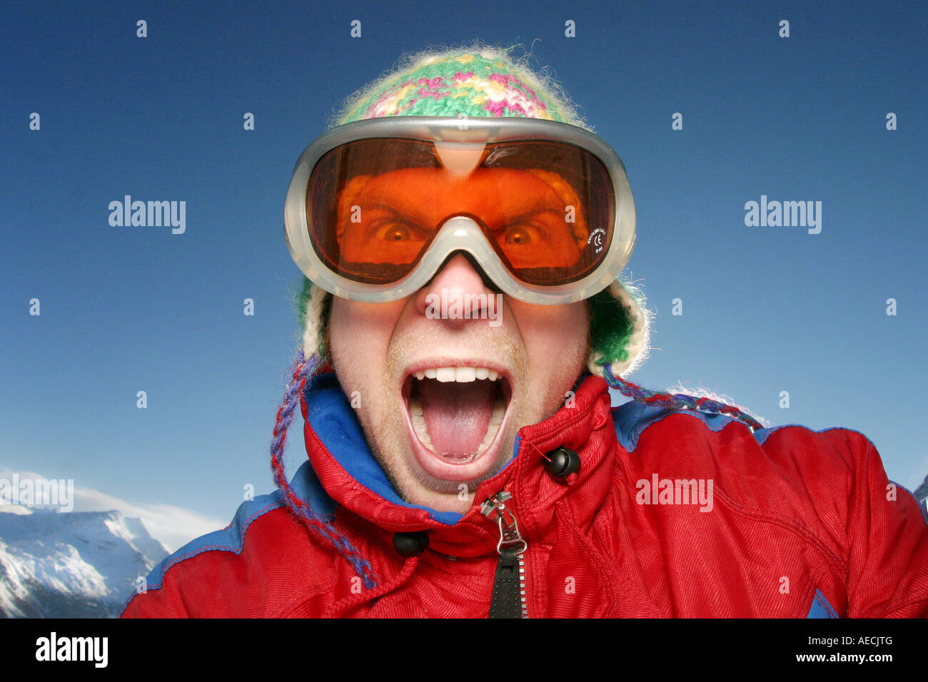 crazy young man with snow goggle, Austria, Alps Stock Photo - Alamy