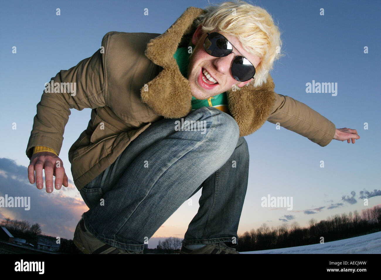 Young man bending forwards hi-res stock photography and images - Alamy