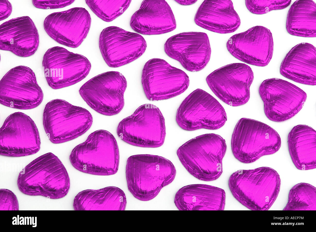 many purple chocolate hearts Stock Photo - Alamy