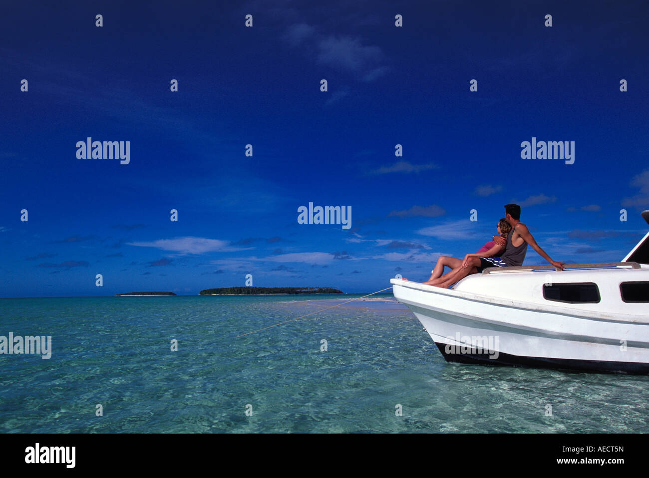 Tonga, Malinoa Island, Couple & Boat Stock Photo - Alamy