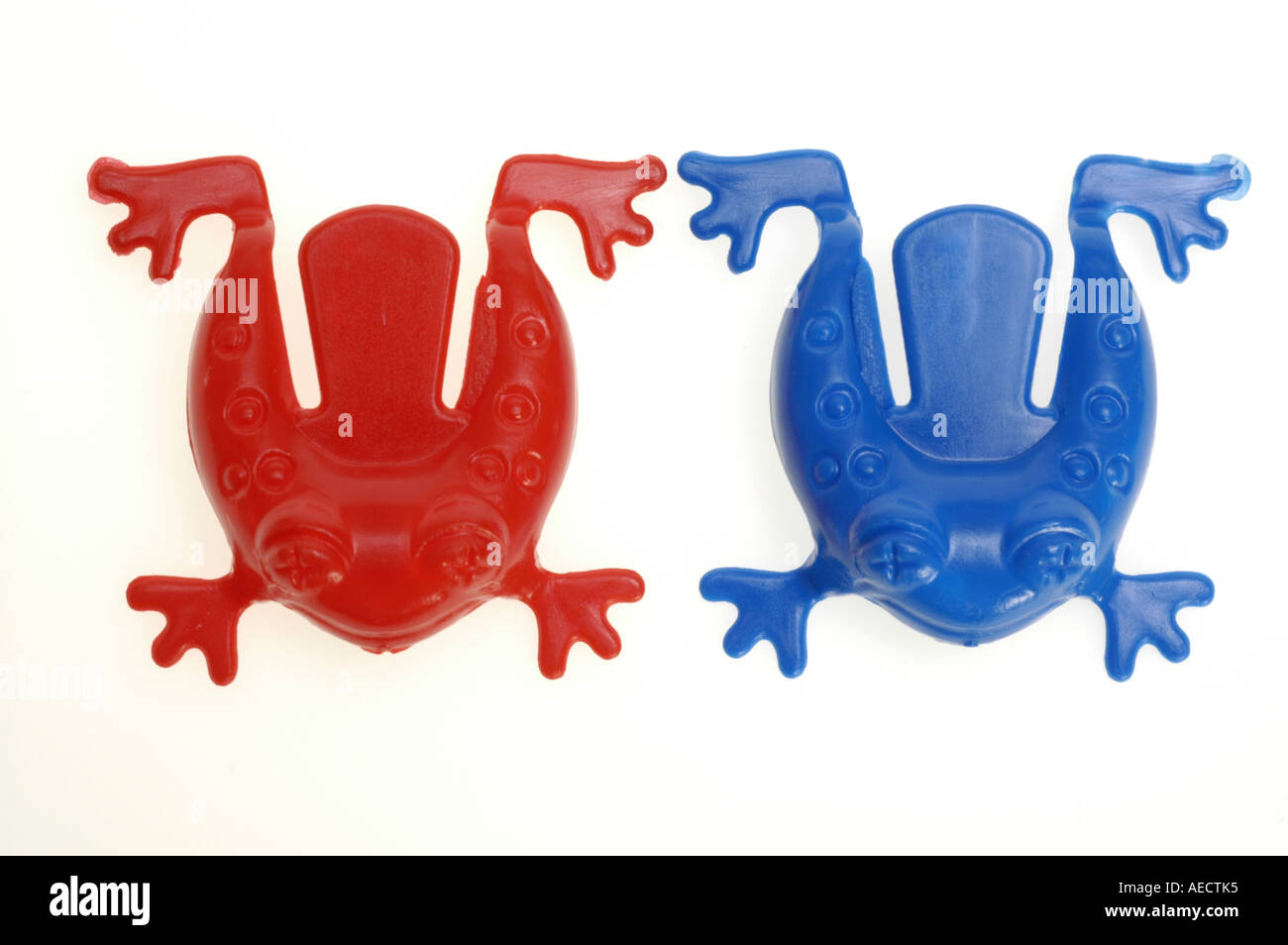 plastic frogs, red, blue, two Stock Photo - Alamy