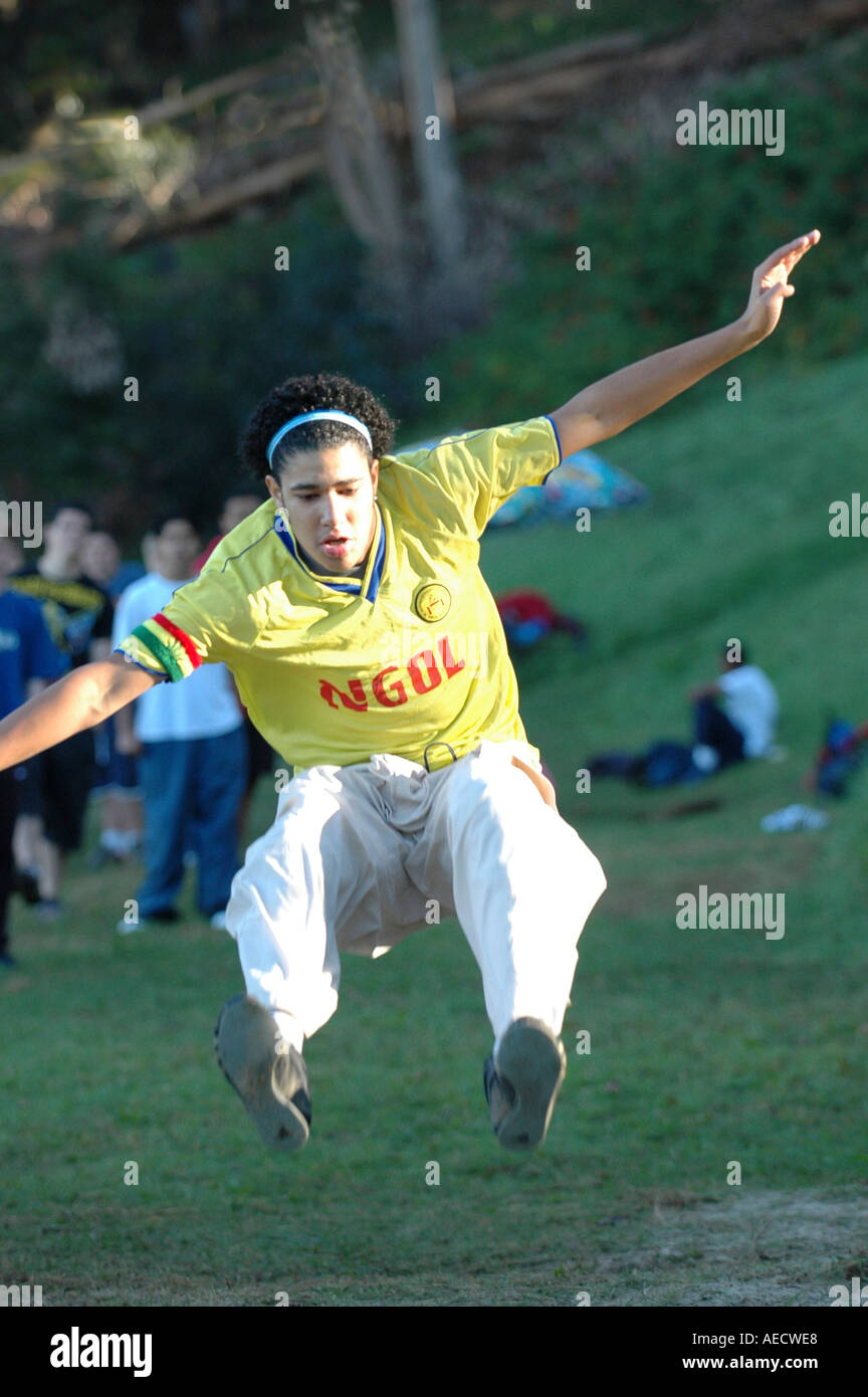 young boy doing long jump Stock Photo - Alamy