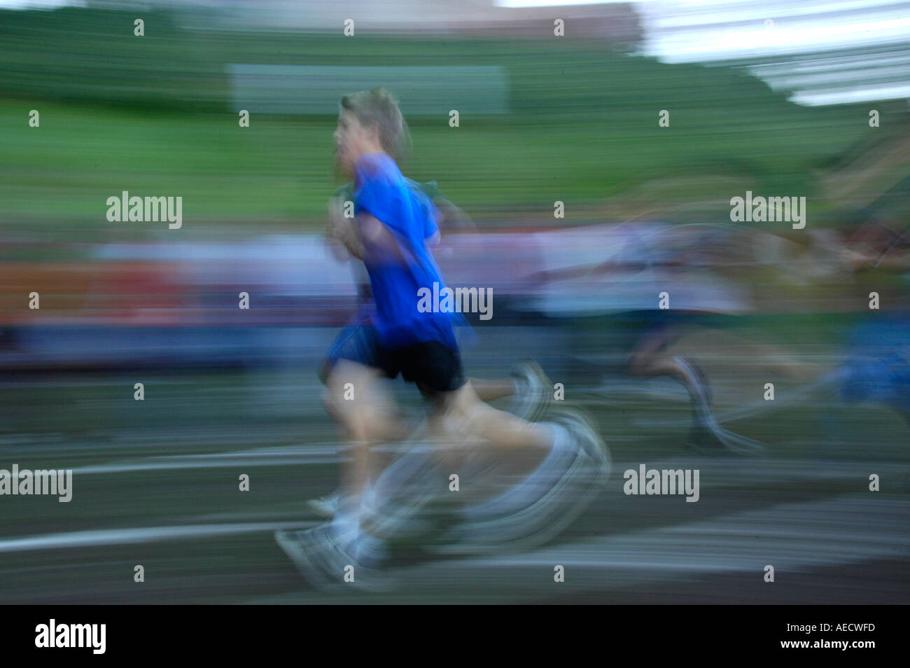 young boys running on athletics track Stock Photo - Alamy