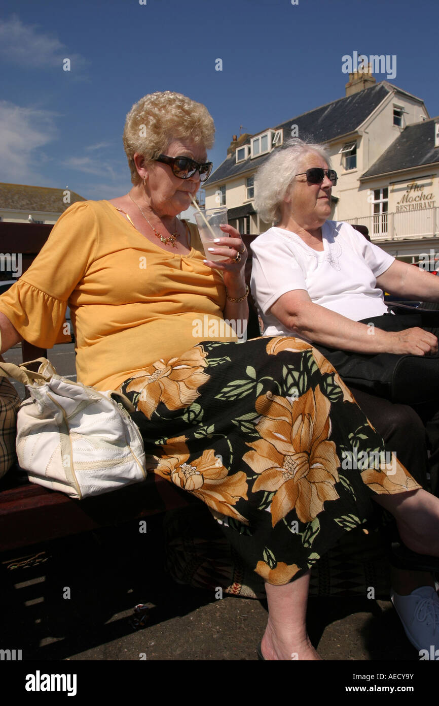 Elderly woman drinking milkshake Sidmouth Devon UK Stock Photo - Alamy