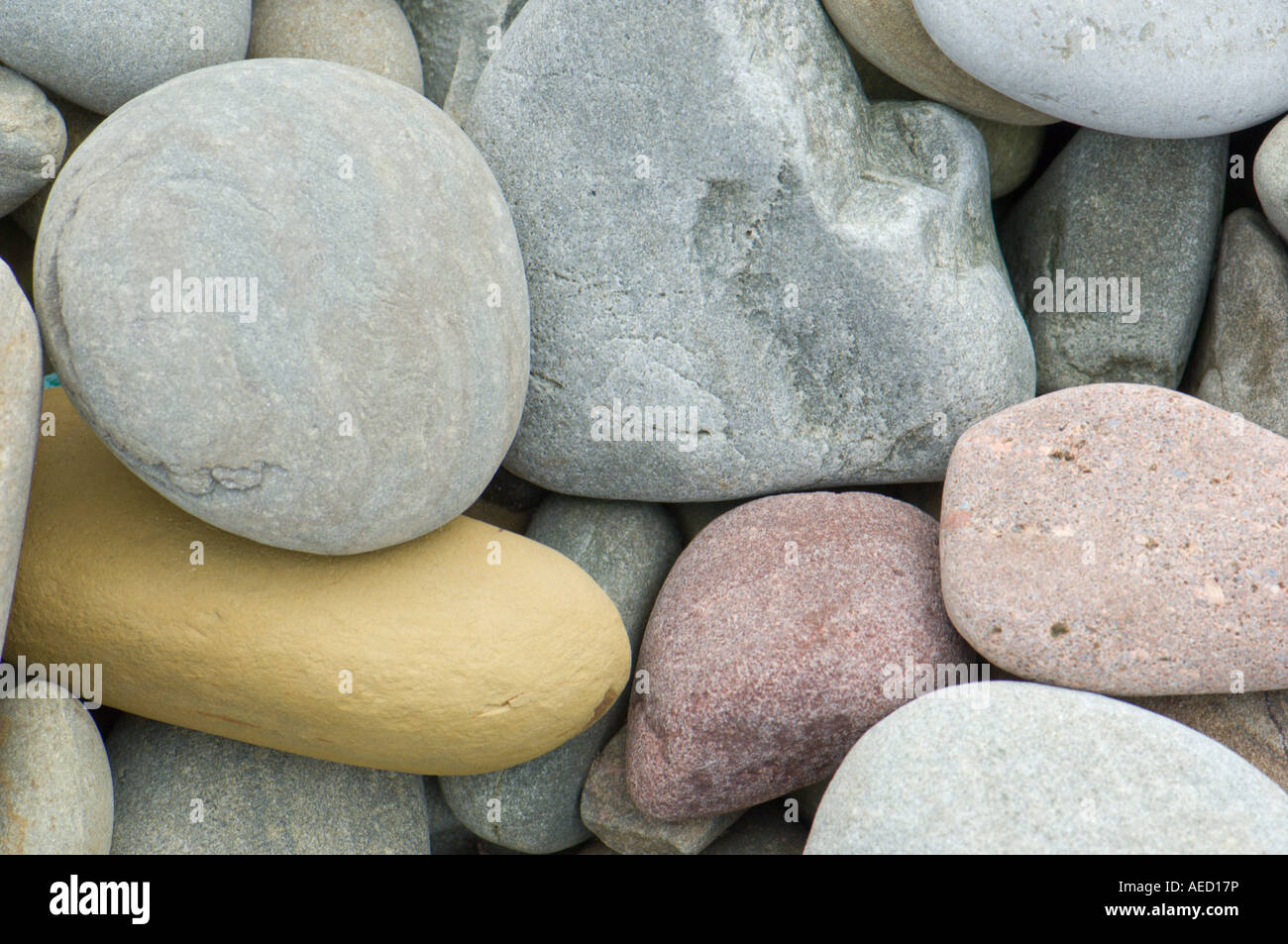 Round colored patterned stones in teh beach, Fair isle, Shetland, UK ...