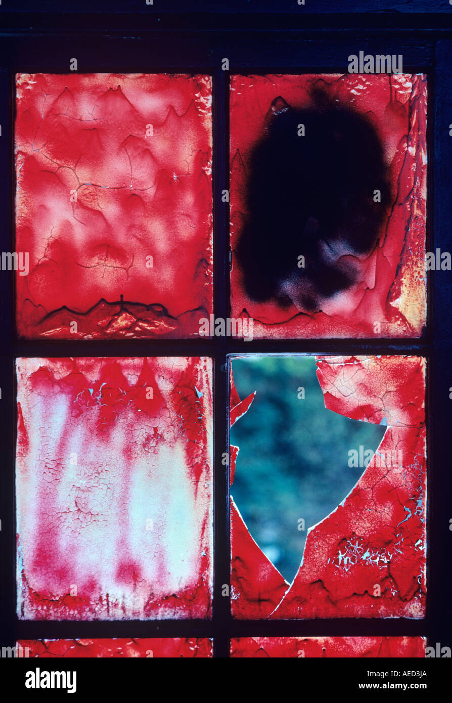 broken window painted red Stock Photo - Alamy