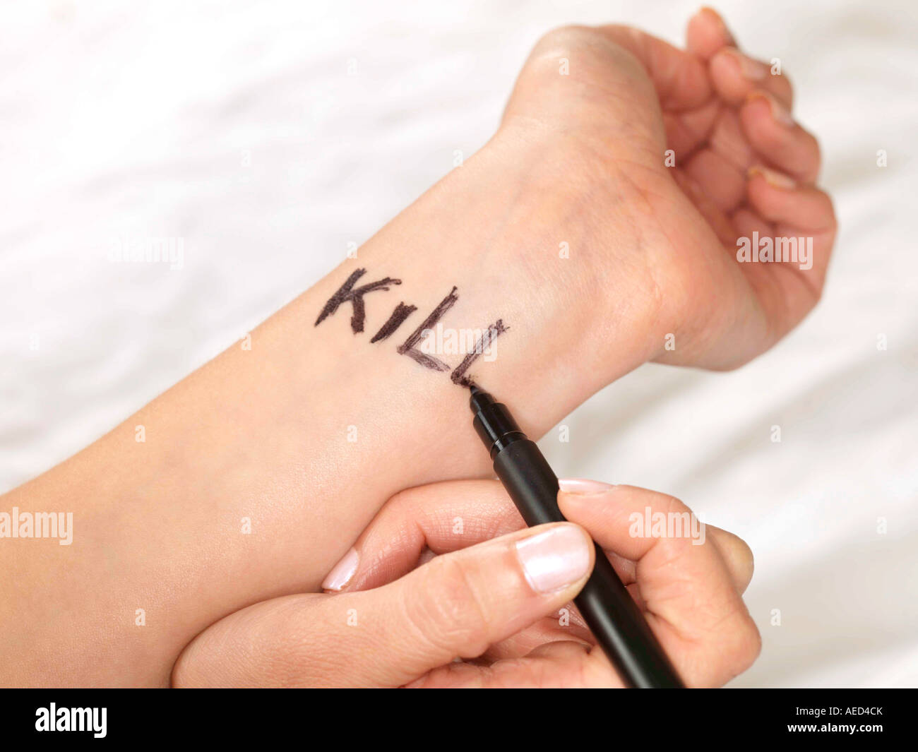 Teenage Girl Writing on her Wrists Model Released Stock Photo - Alamy