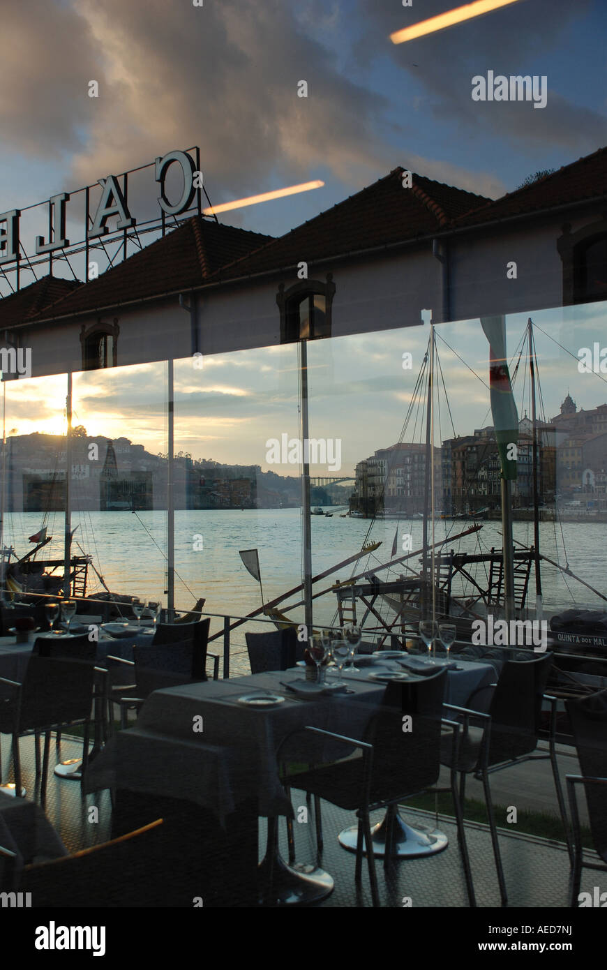 View of the Douro and sunset through glass window of restaurant Stock ...