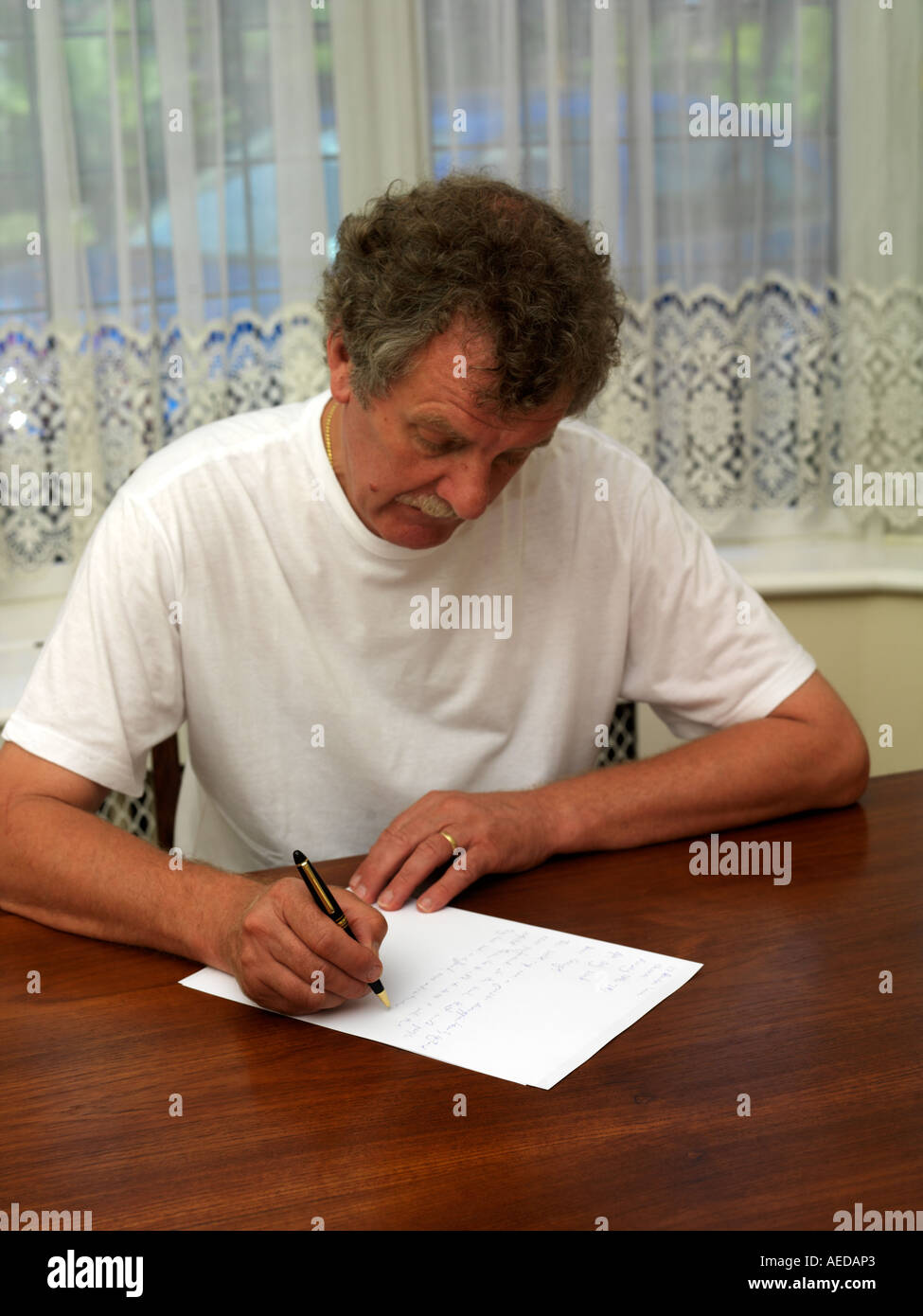 Man Writing at Home Stock Photo - Alamy