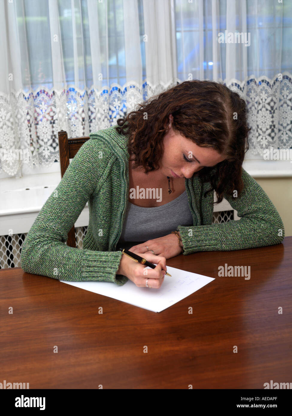 Woman writing on hi-res stock photography and images - Alamy