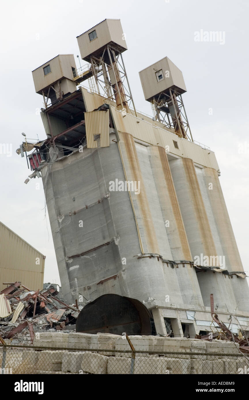 Leaning concrete tower during explosive demolition Stock Photo - Alamy