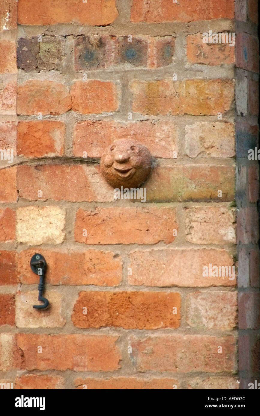 cottage garden brick face in wall Stock Photo - Alamy