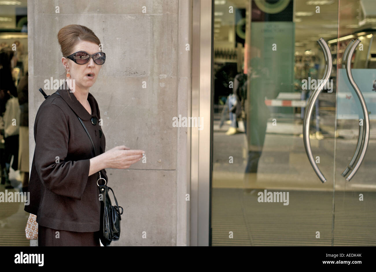 Woman smoking on the street Stock Photo - Alamy
